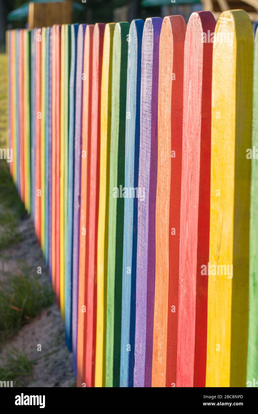 Bright, multi colorful fence on children's playground Stock Photo - Alamy