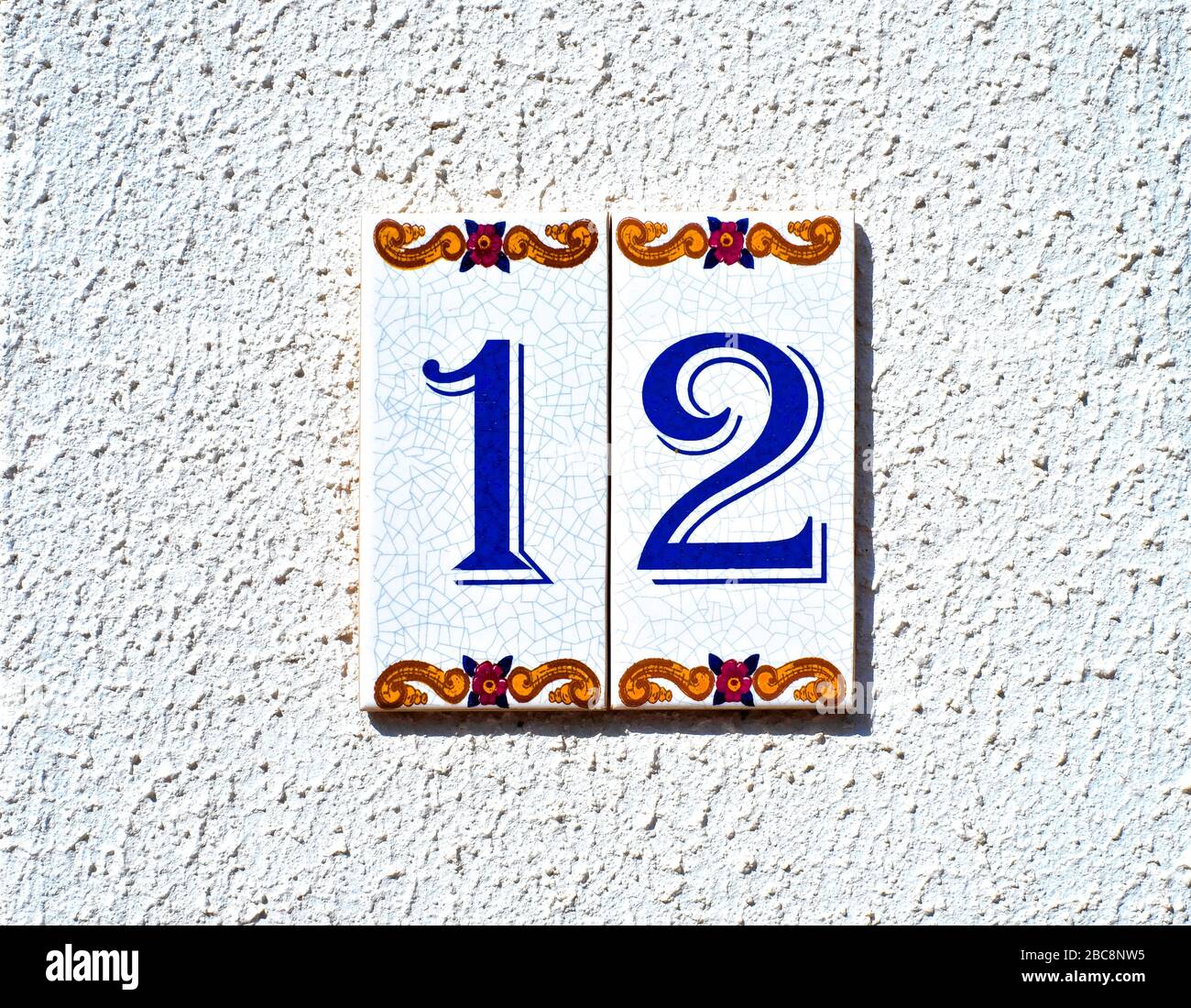 Decorative tiles with home number 12 / twelve Stock Photo - Alamy