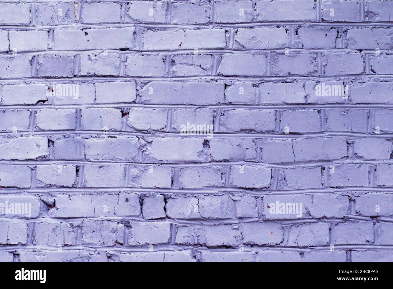 Brick wall painted in violet color, background Stock Photo - Alamy