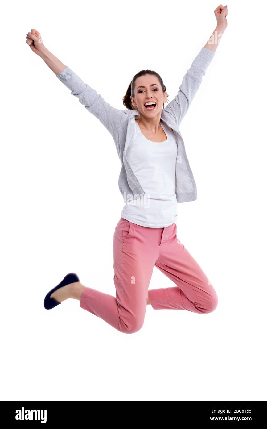 Laughing young woman jumping hi-res stock photography and images - Alamy