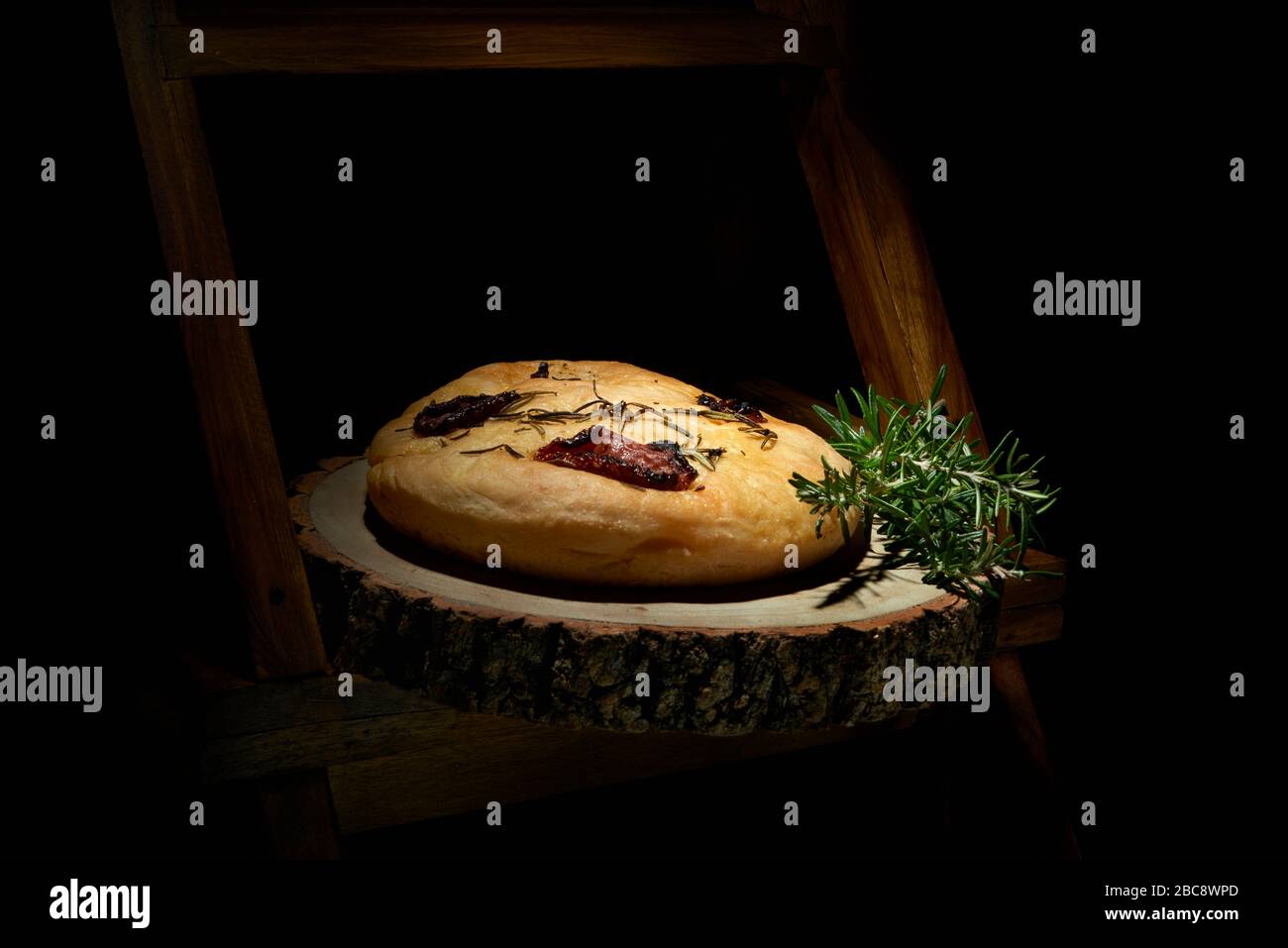 Display of homemade Italian style Focaccia loaf with rosemary and sun ...