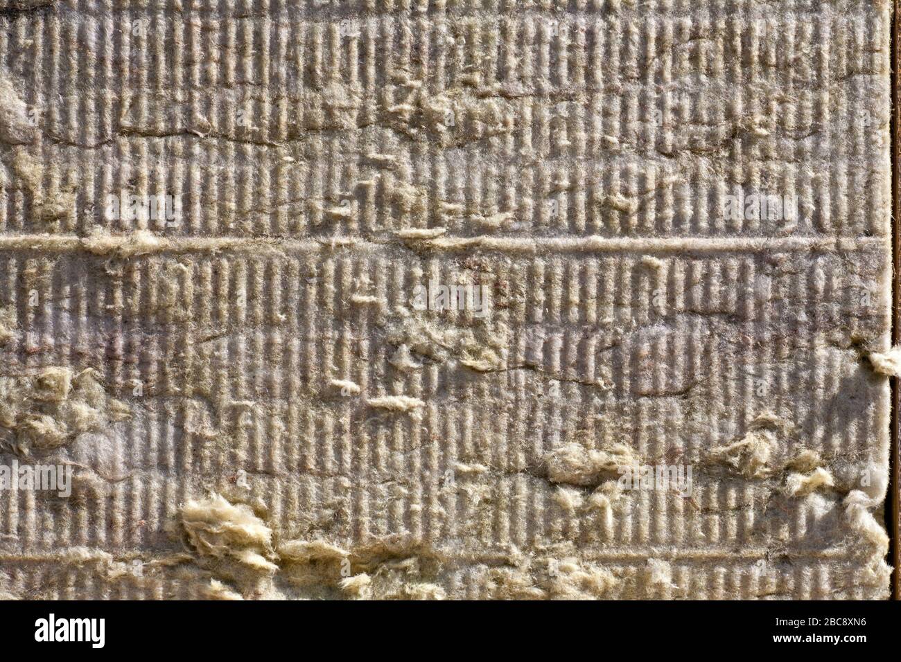 warming the walls of a stone house with a stone wool heater. Ecological ...