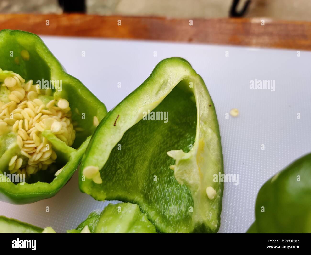 slice of green bell pepper or capsicum isolated on white background ...