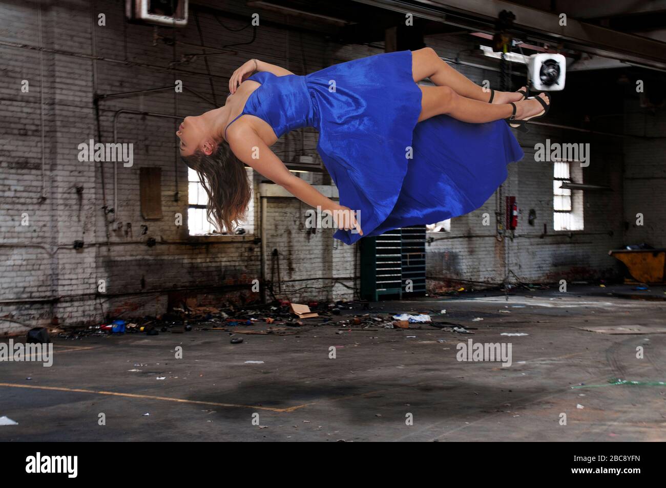 Beautiful young woman floating in the air Stock Photo - Alamy