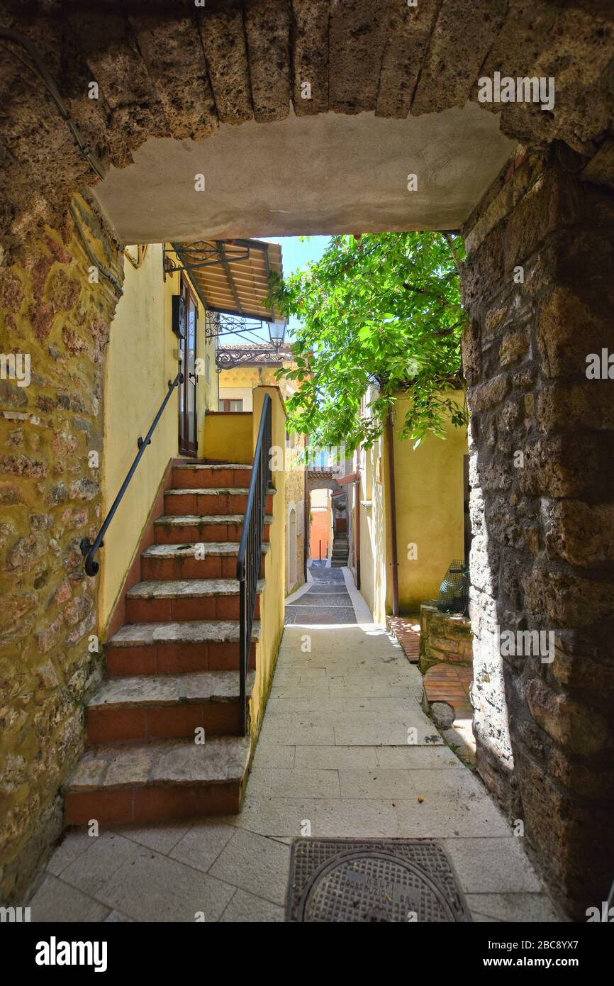 A narrow street between the houses of Scapoli, a village in the Molise ...