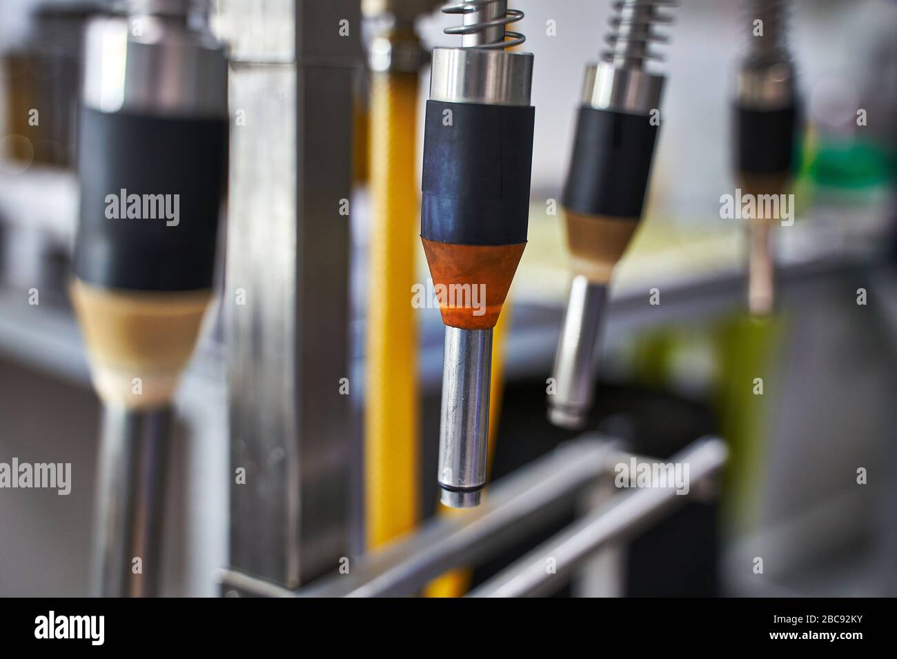 In-line tools for filling beer bottles in a brewery. Industry concept ...