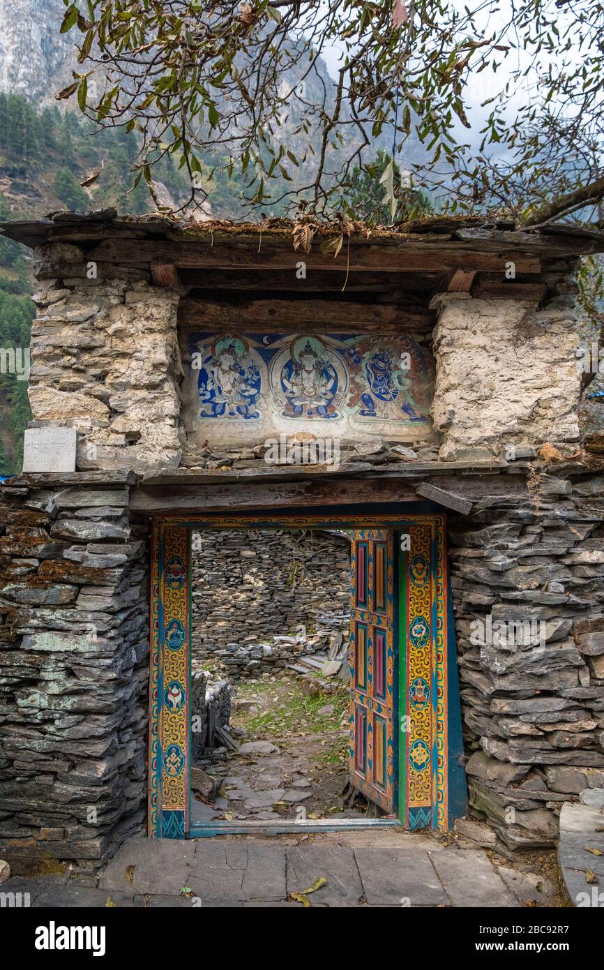 Colorful gate in Namrung in Nepal Stock Photo - Alamy