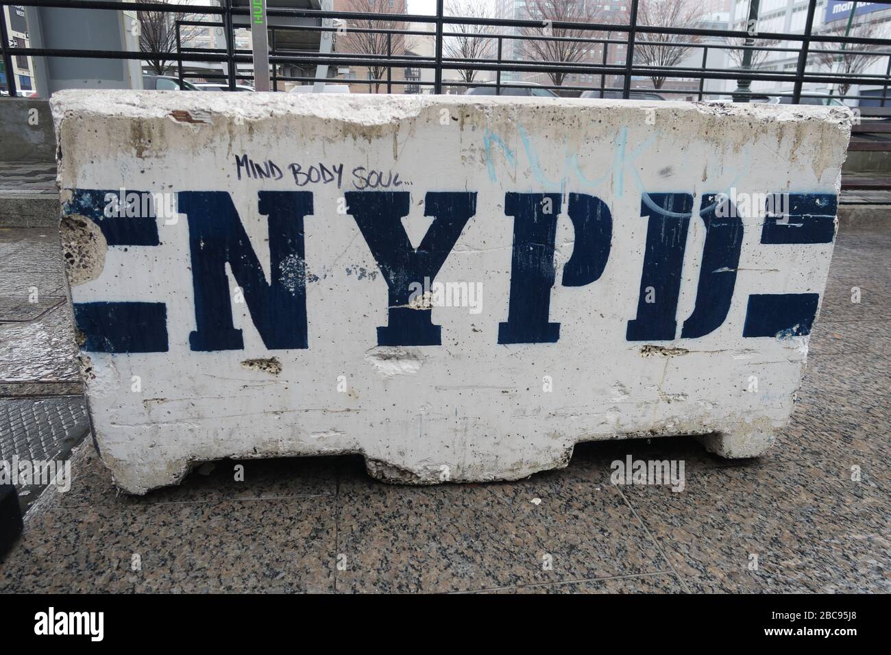 NYPD stencilled concrete security barrier Stock Photo - Alamy