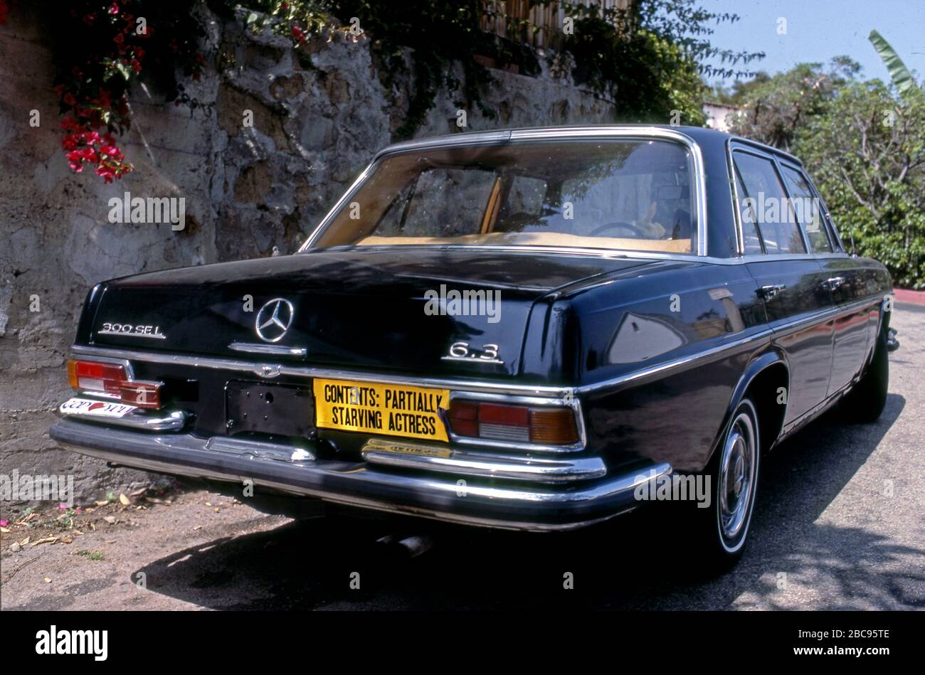 Mercedes Benz sedan in the Hollywood Hills with humorous bumper sticker ...