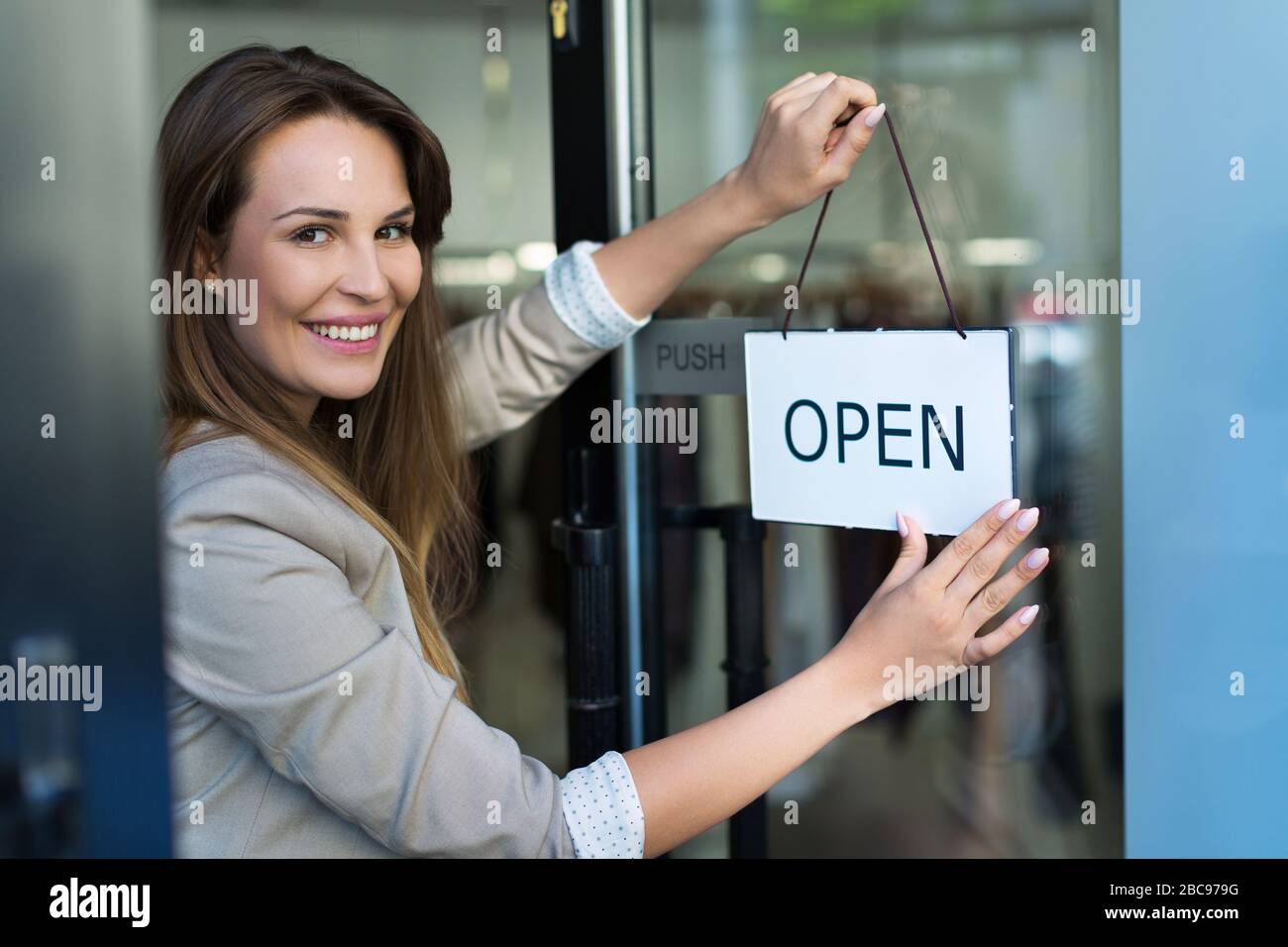 Woman working clothes store hi-res stock photography and images - Alamy