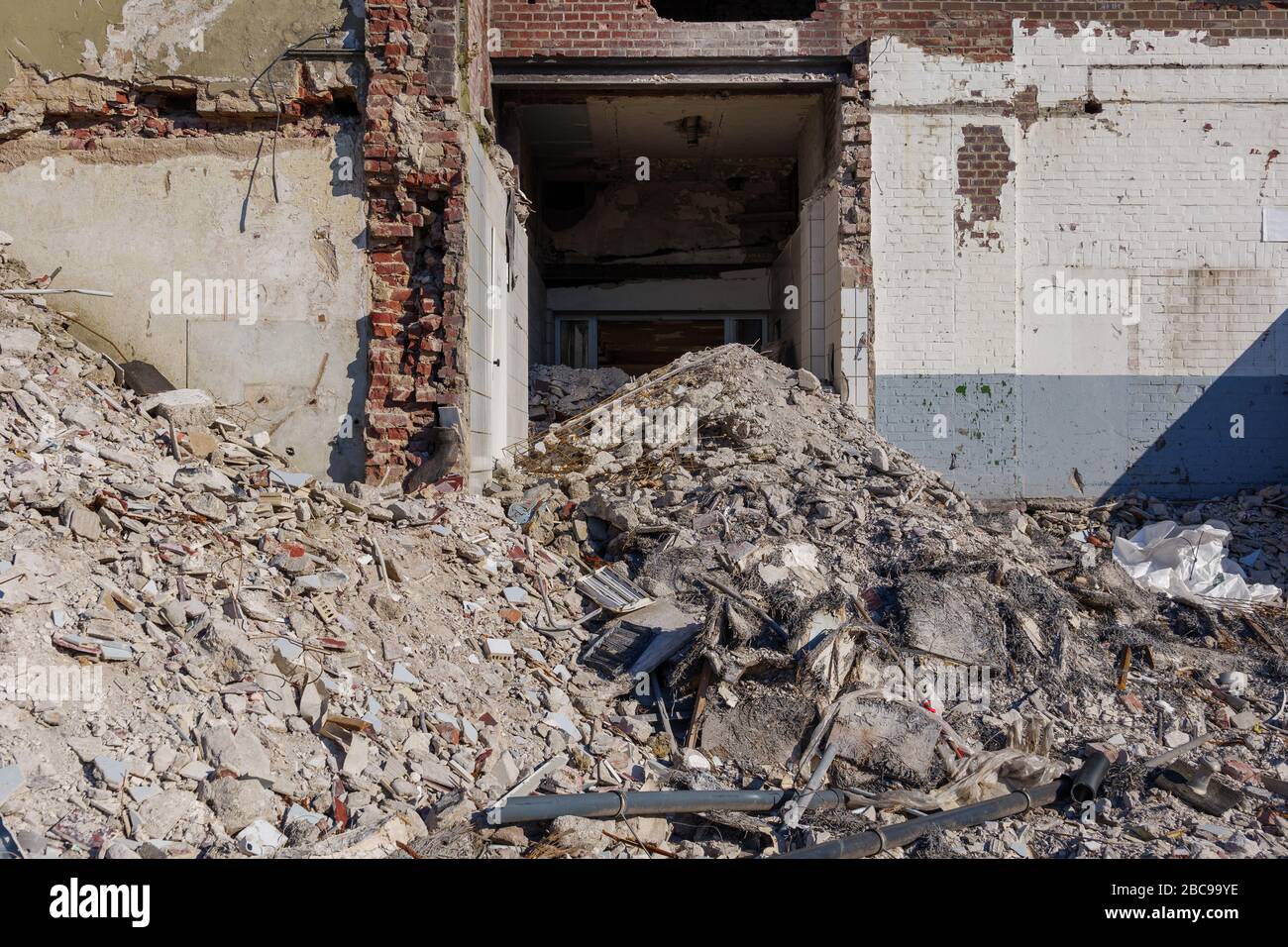 Side view of existing brick and tile wall, door and ruin of tile and ...