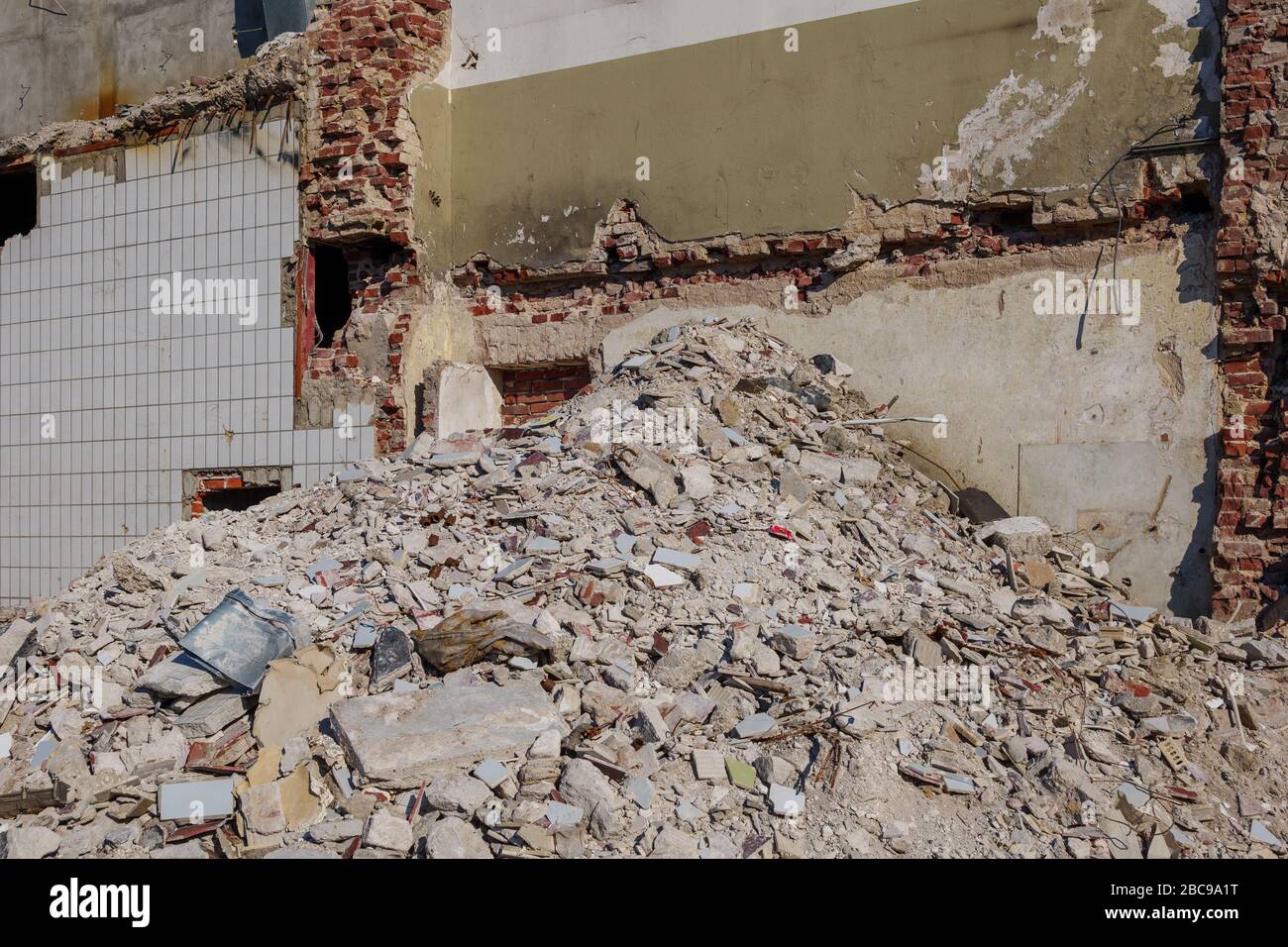 Side view of existing brick and tile wall, door and ruin of tile and ...