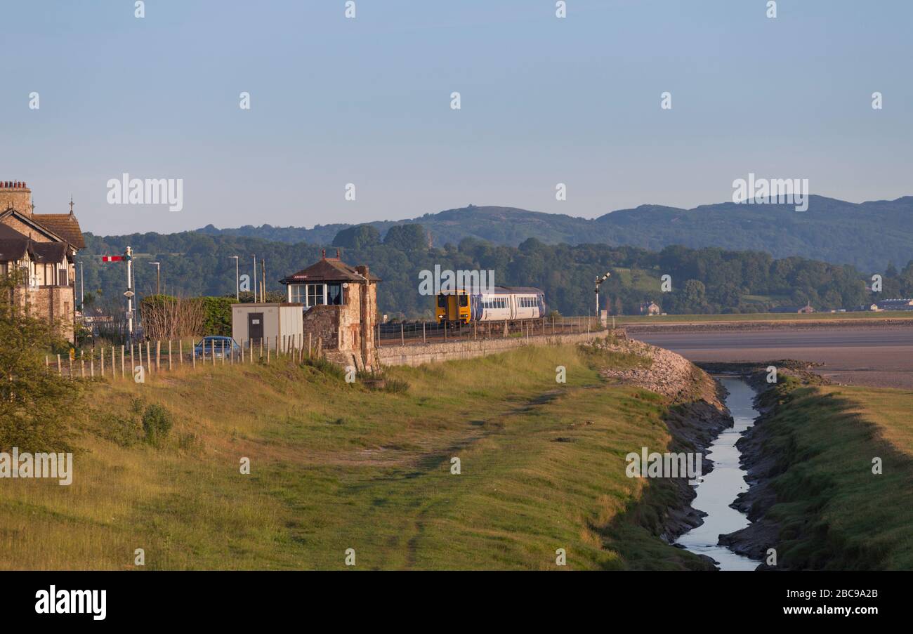 Northern Rail class 156 sprinter train passing Arnside signalbox on the ...