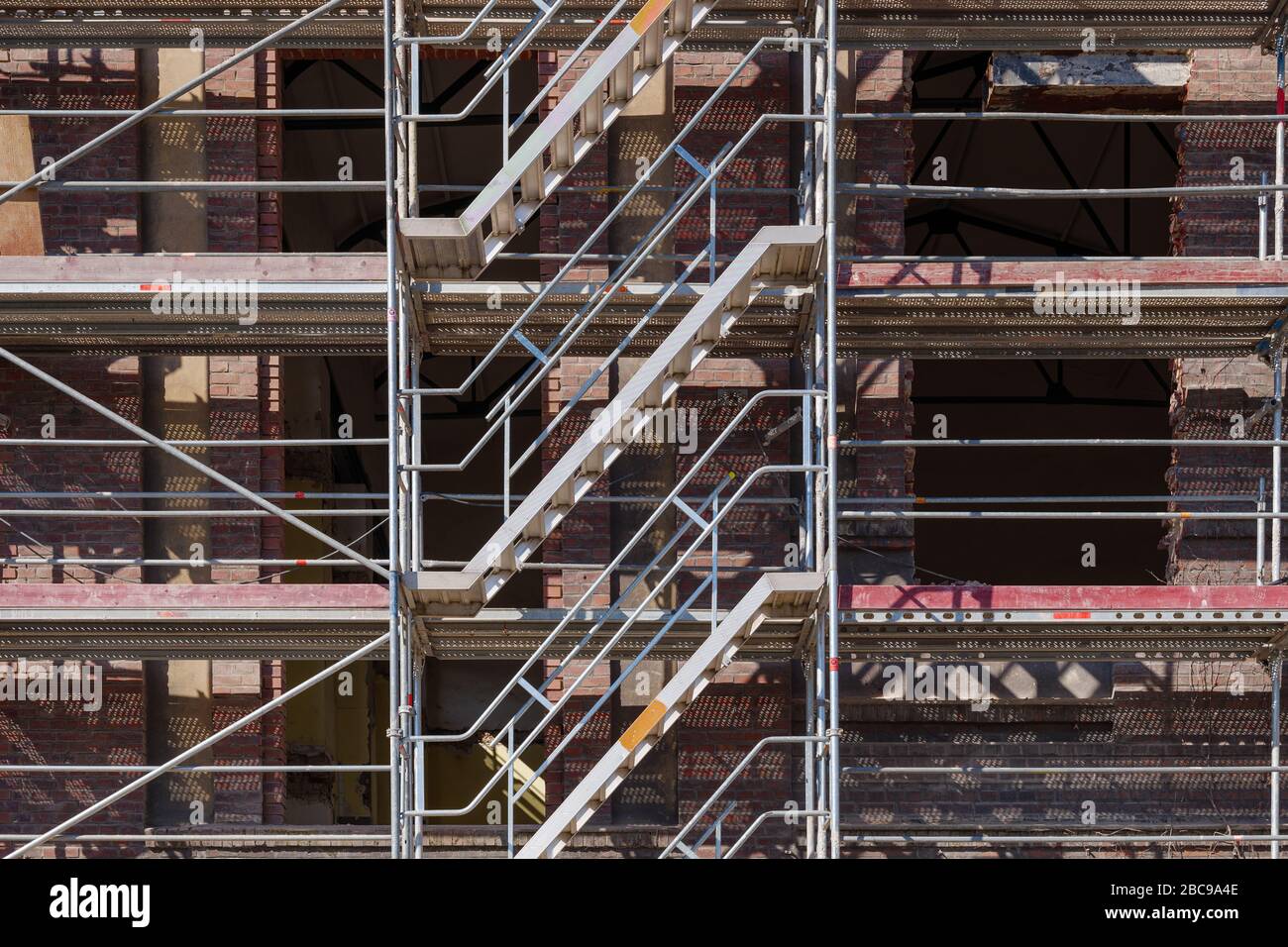 Front view of scaffolds in front of old historical building with ...