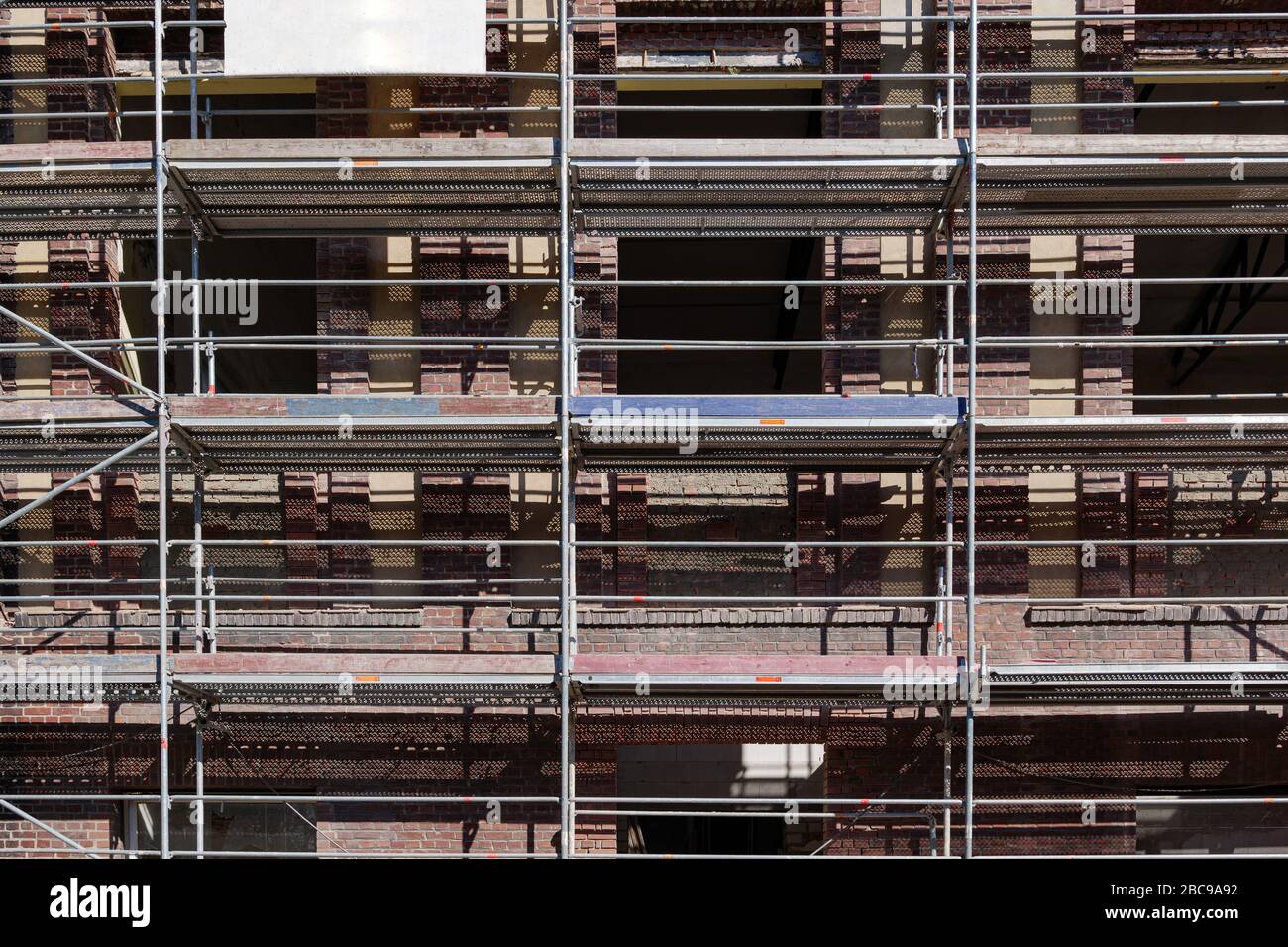 Front view of scaffolds in front of old historical building with ...
