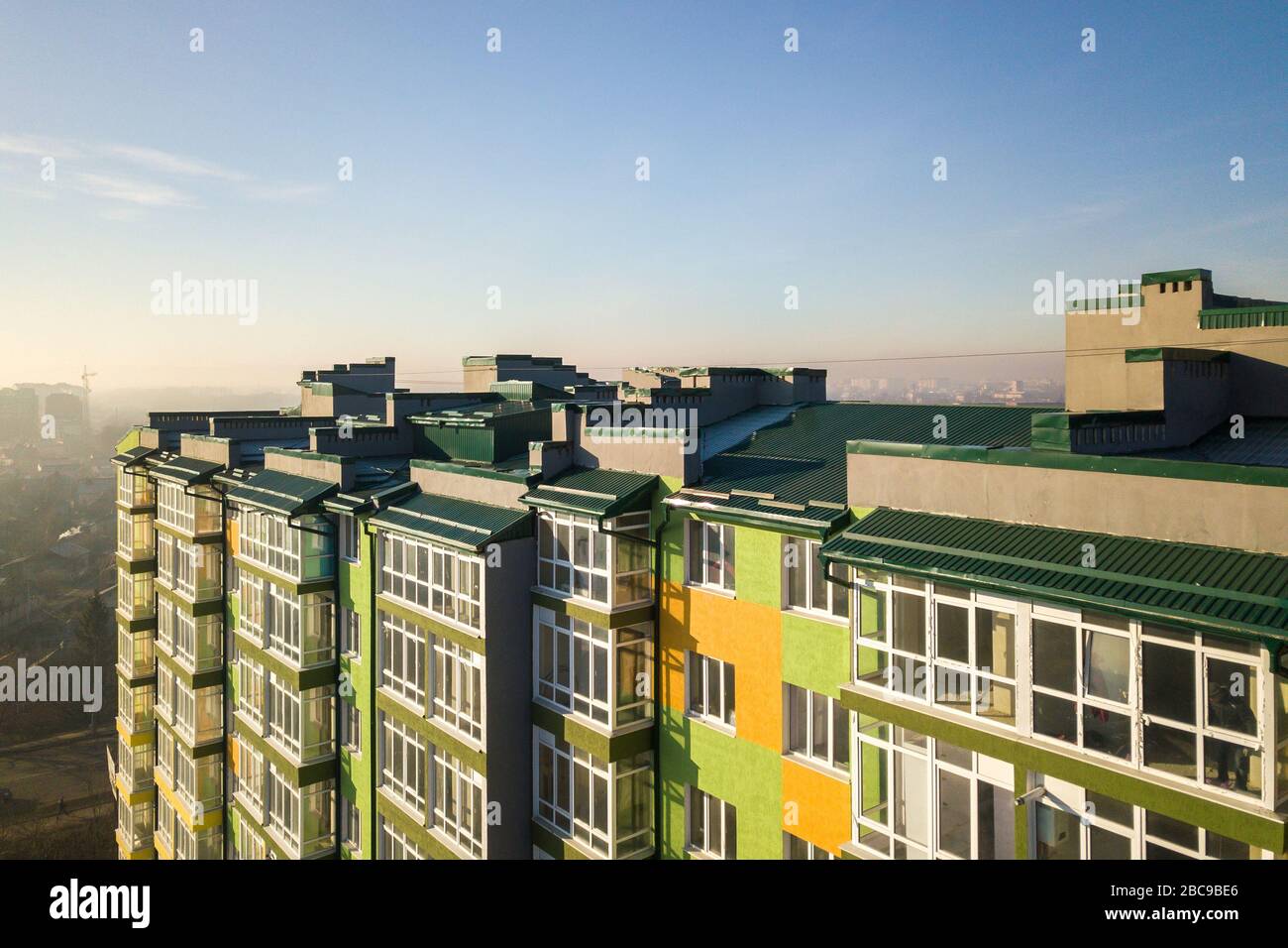 Aerial view of a tall residential apartment building with many windows ...