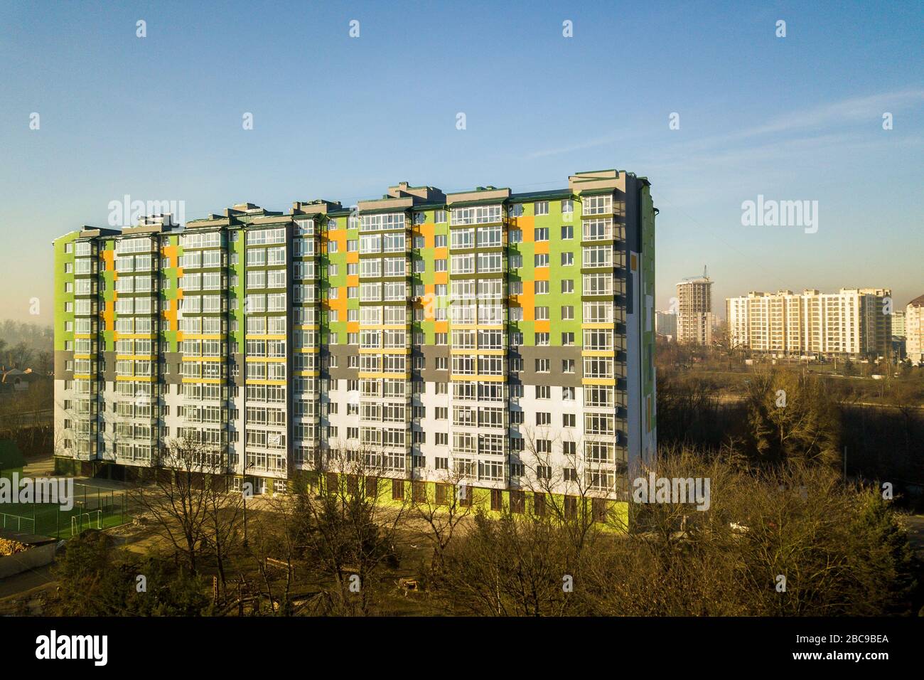 Aerial view of a tall residential apartment building with many windows ...