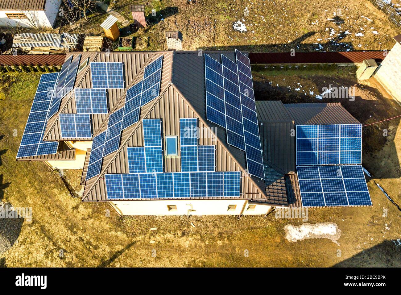 Aerial top view of new modern residential house cottage with blue shiny ...