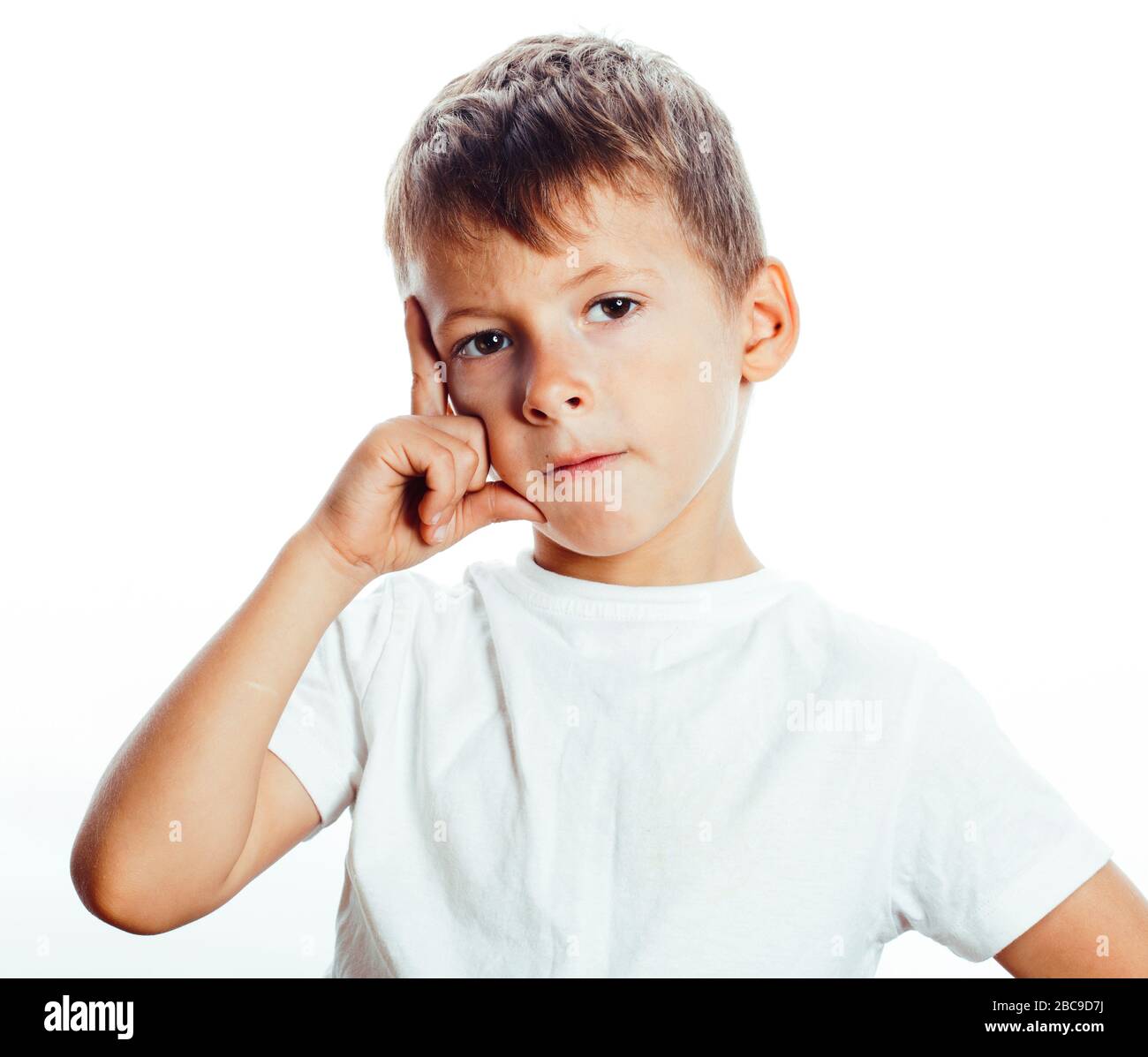 young pretty little boy wondering face gesturing, pointing isolated on ...