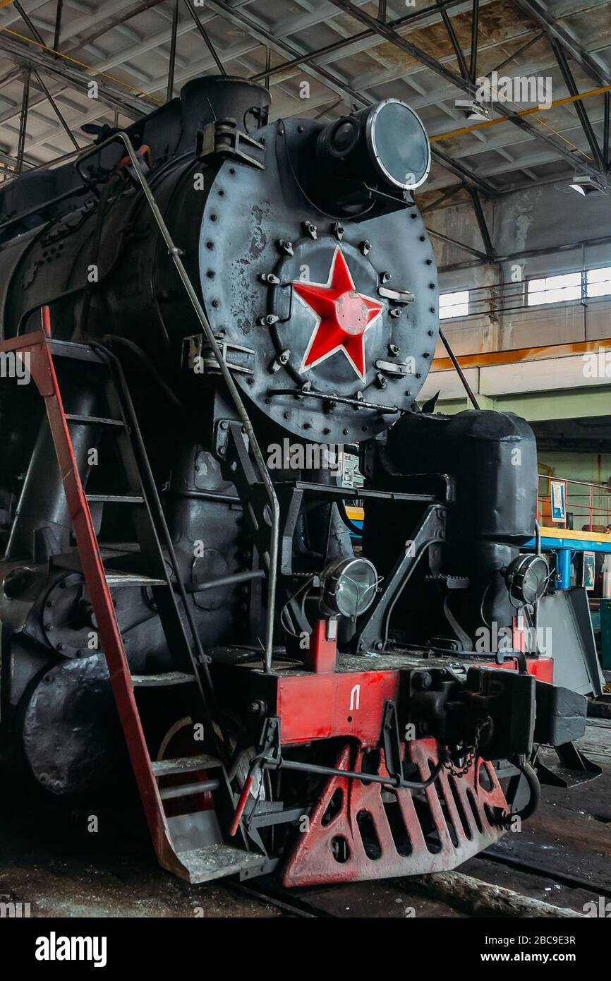 Old Soviet steam locomotive at the train depot Stock Photo - Alamy