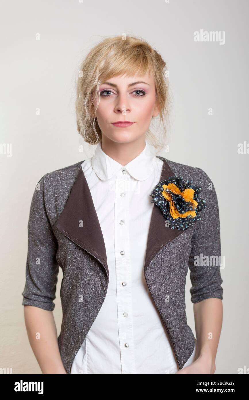 Beautiful female model portrait wearing glittering jacket with flower ...