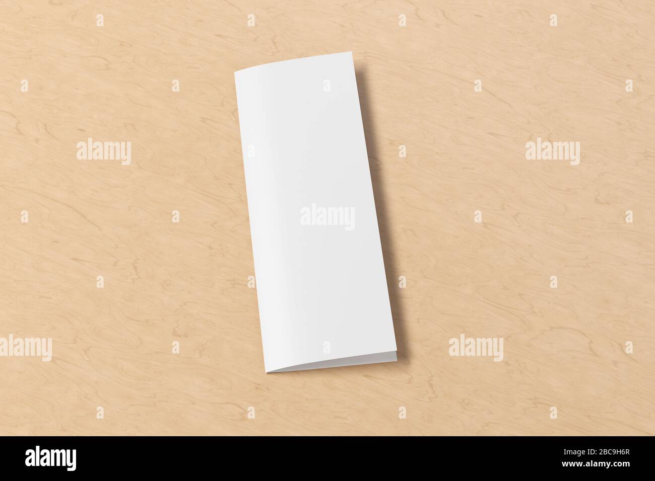 Blank vertical A4 leaflet on wooden background. Bi-fold or half-fold ...