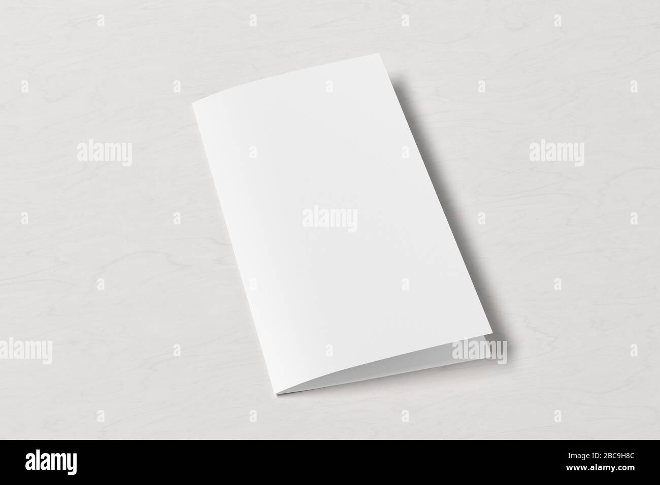 Blank square leaflet on white wooden background. Bi-fold or half-fold ...
