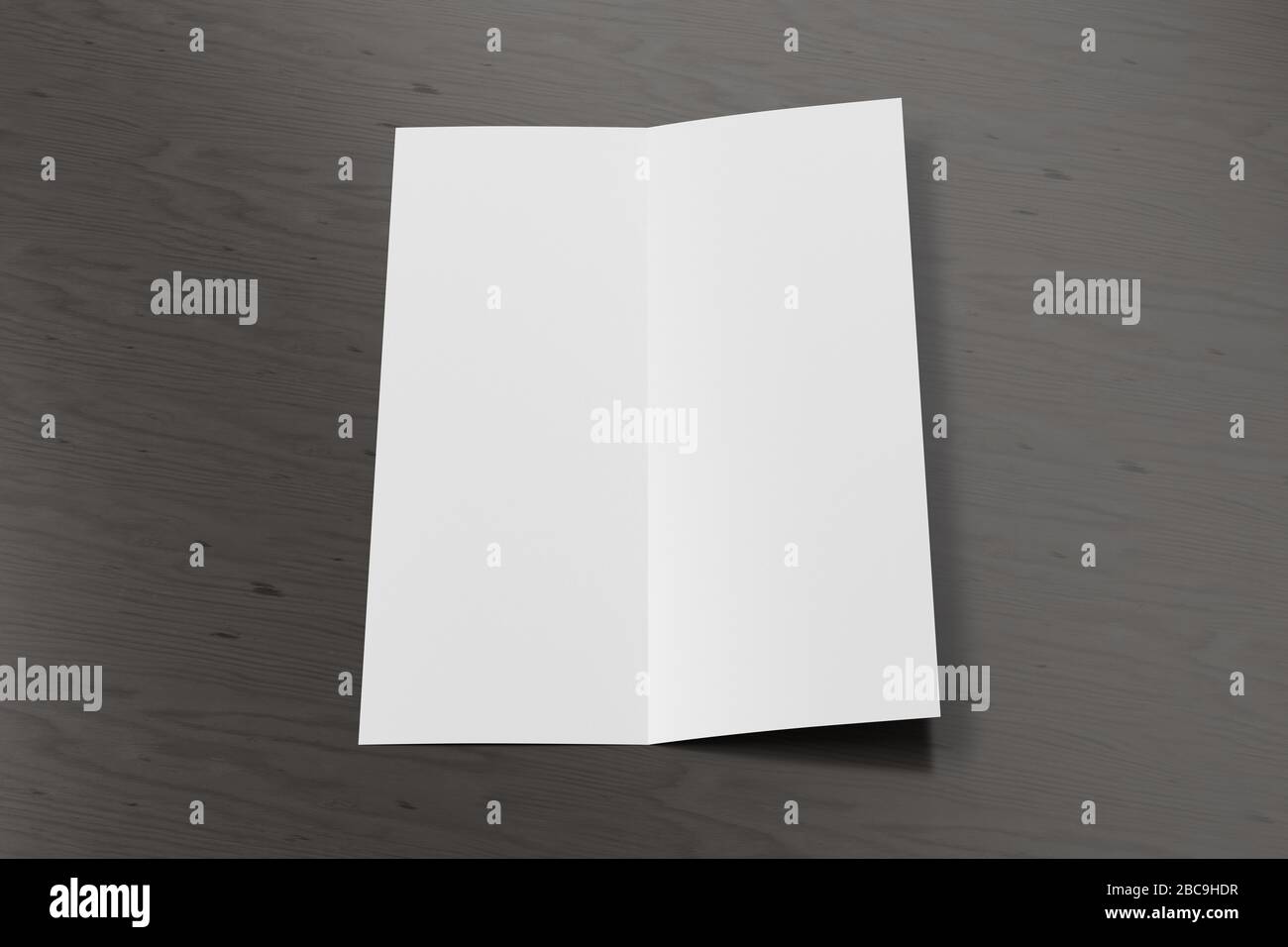 Blank vertical A4 leaflet on black wooden background. Bi-fold or half ...