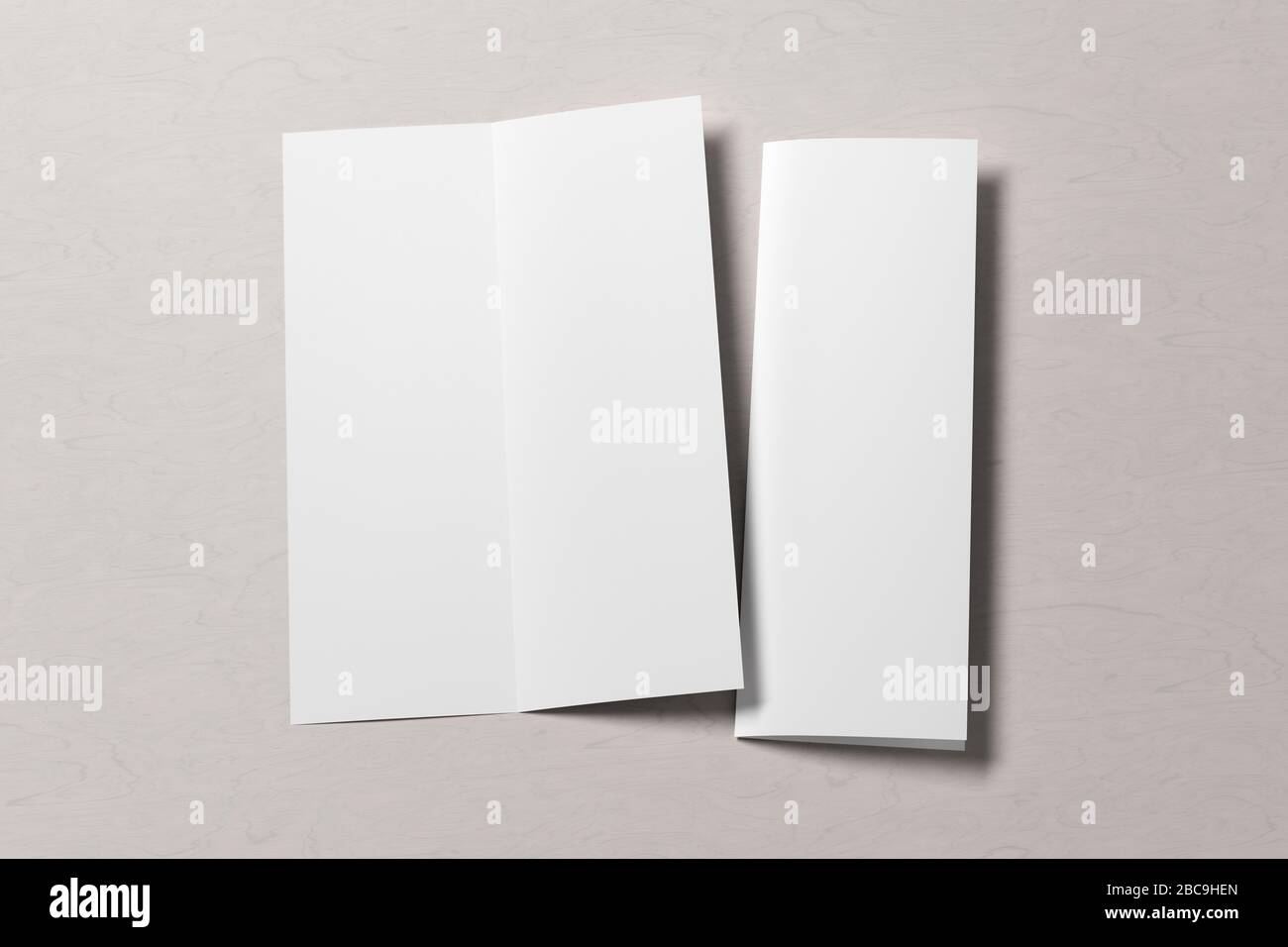 Blank vertical A4 leaflet on white wooden background. Bi-fold or half ...