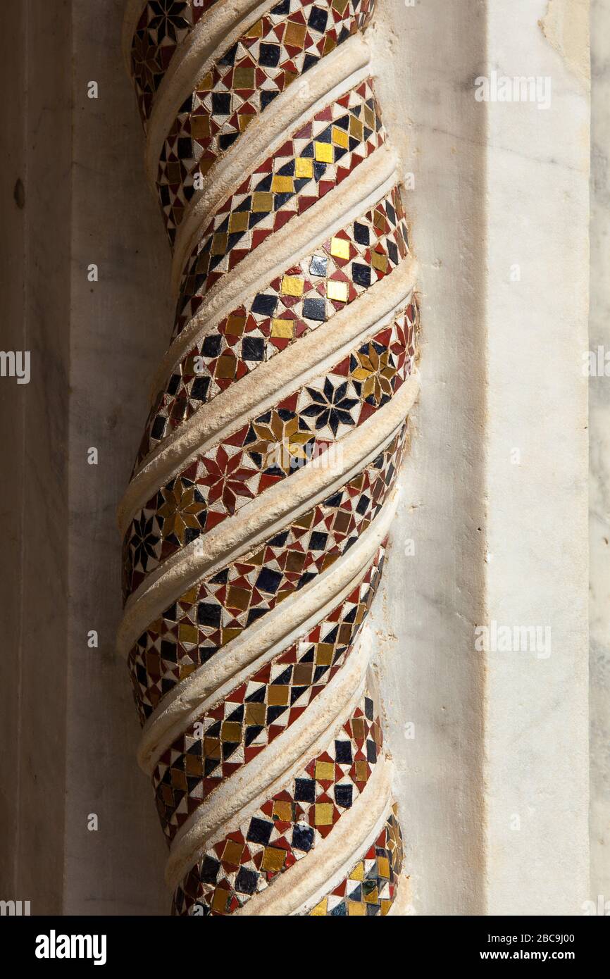 Twisted column in the Cosmatesque or Cosmati style in the courtyard of ...