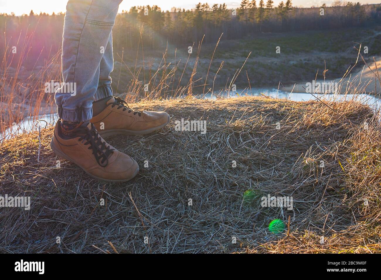 The traveler's feet on the hill of the mountain Stock Photo - Alamy