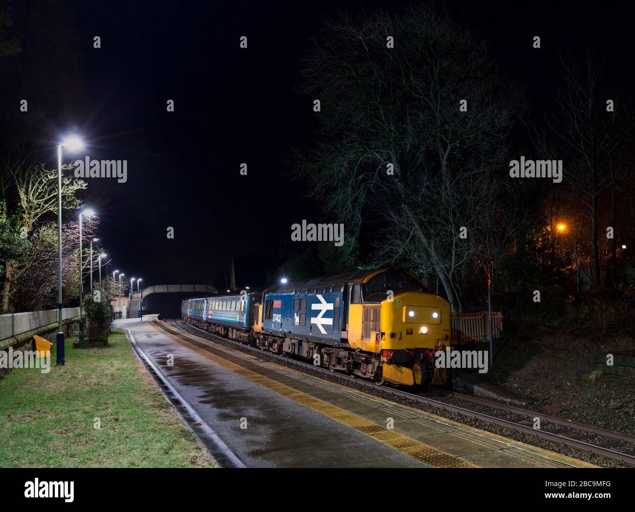 Direct rail services class 37 locomotive 37402 calling at Cark railway ...