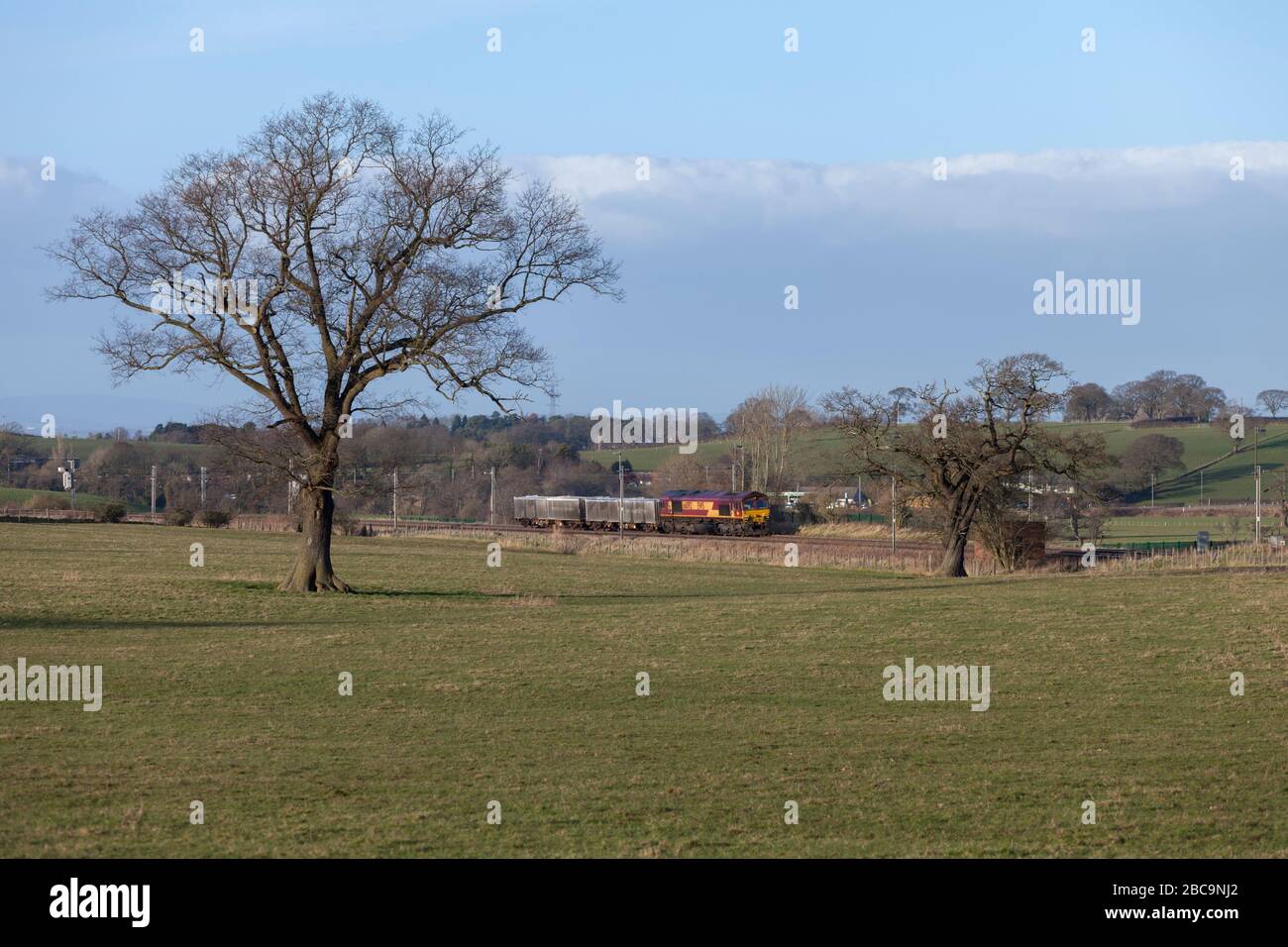 DB Cargo class 66 diesel locomotive 66092 with a short freight train ...