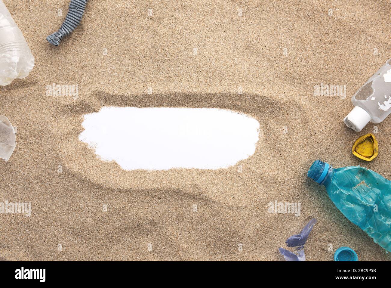 Garbage collected on sand with copy space. Top view Stock Photo - Alamy
