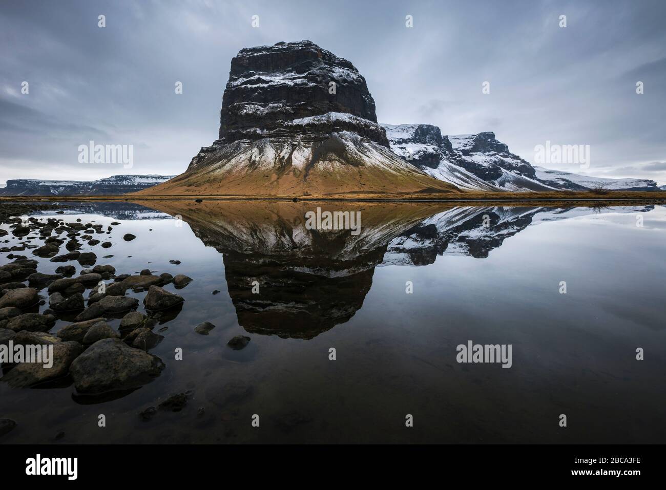 Slightly snowy mountains near Kálfafell with reflection, Suðurland ...