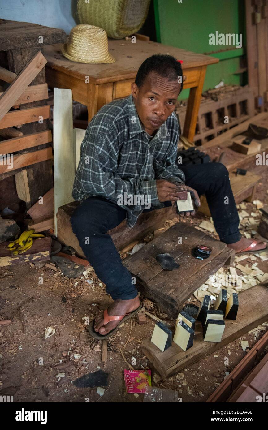 Africa, Madagascar, Ambositra city. Men making wooden handicrafts. The ...