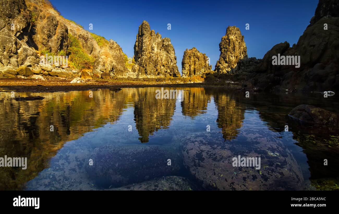 dramatic rock scenery with reflection and light before sunset Stock ...