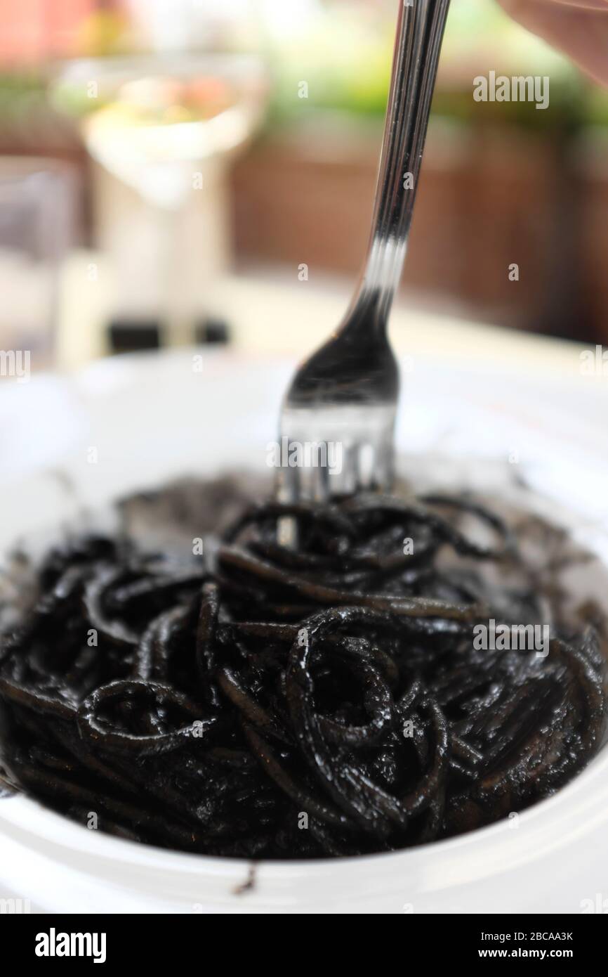 Black pastas hi-res stock photography and images - Alamy