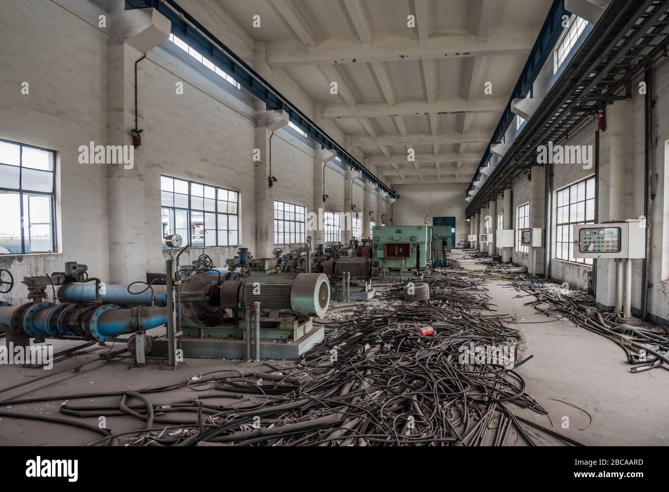 Interior of an old abandoned industrial steel factory Stock Photo - Alamy