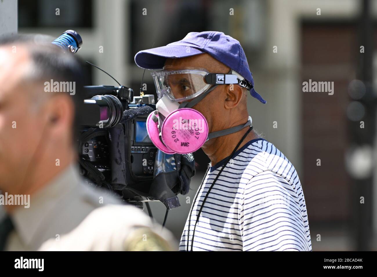 Riverside, United States. 03rd Apr, 2020. A KTLA 5 videographer wears ...
