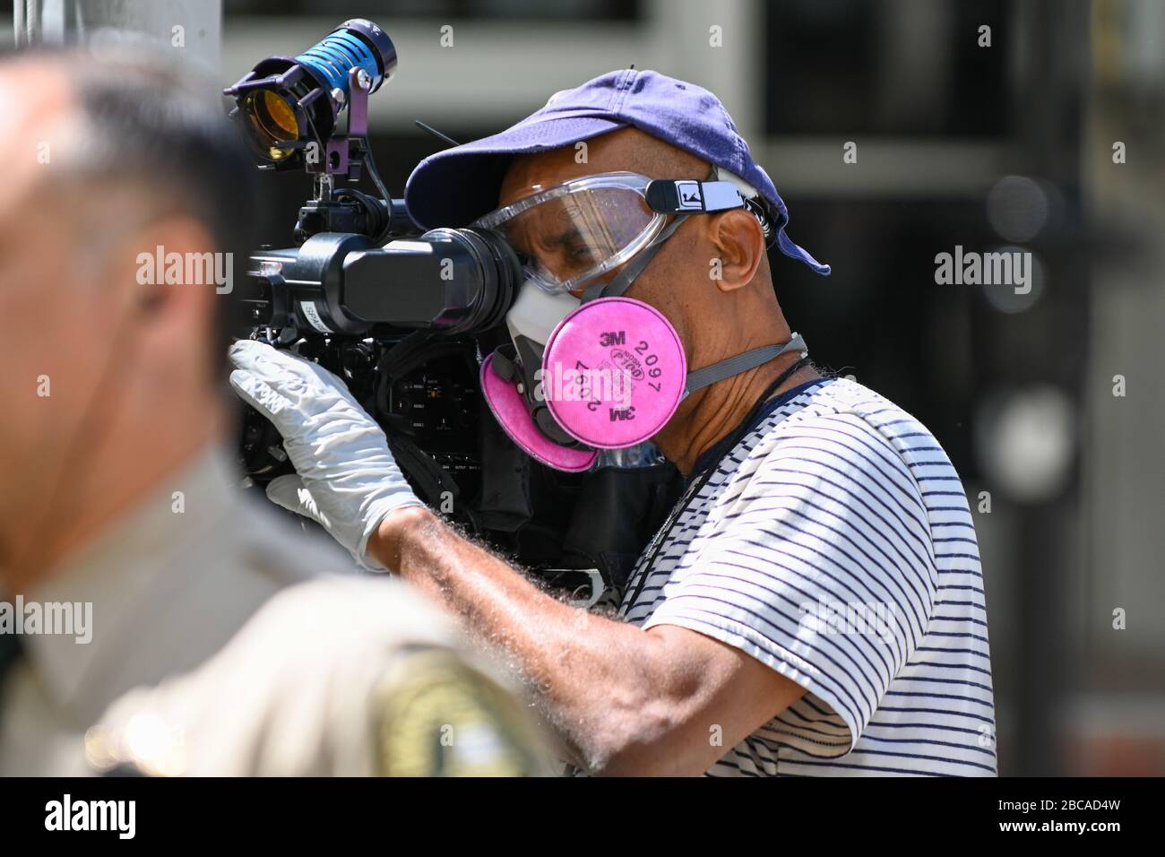 Riverside, United States. 03rd Apr, 2020. A KTLA 5 videographer wears ...