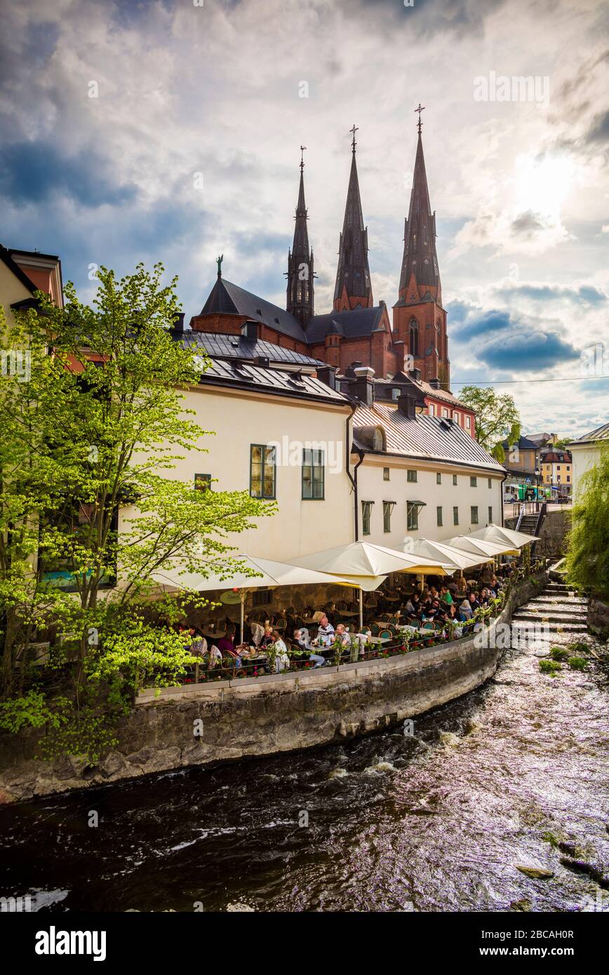 Sweden, Central Sweden, Uppsala, Domkyrka Cathedral with riverfront ...