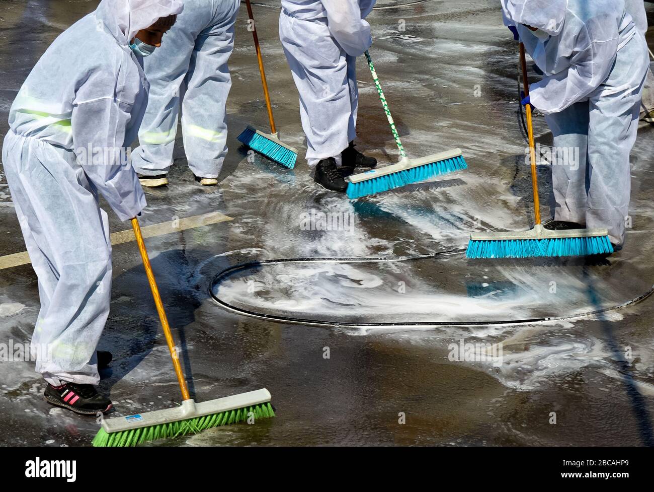Bucharest, Romania - April 03, 2020: Sanitation employees clean the ...