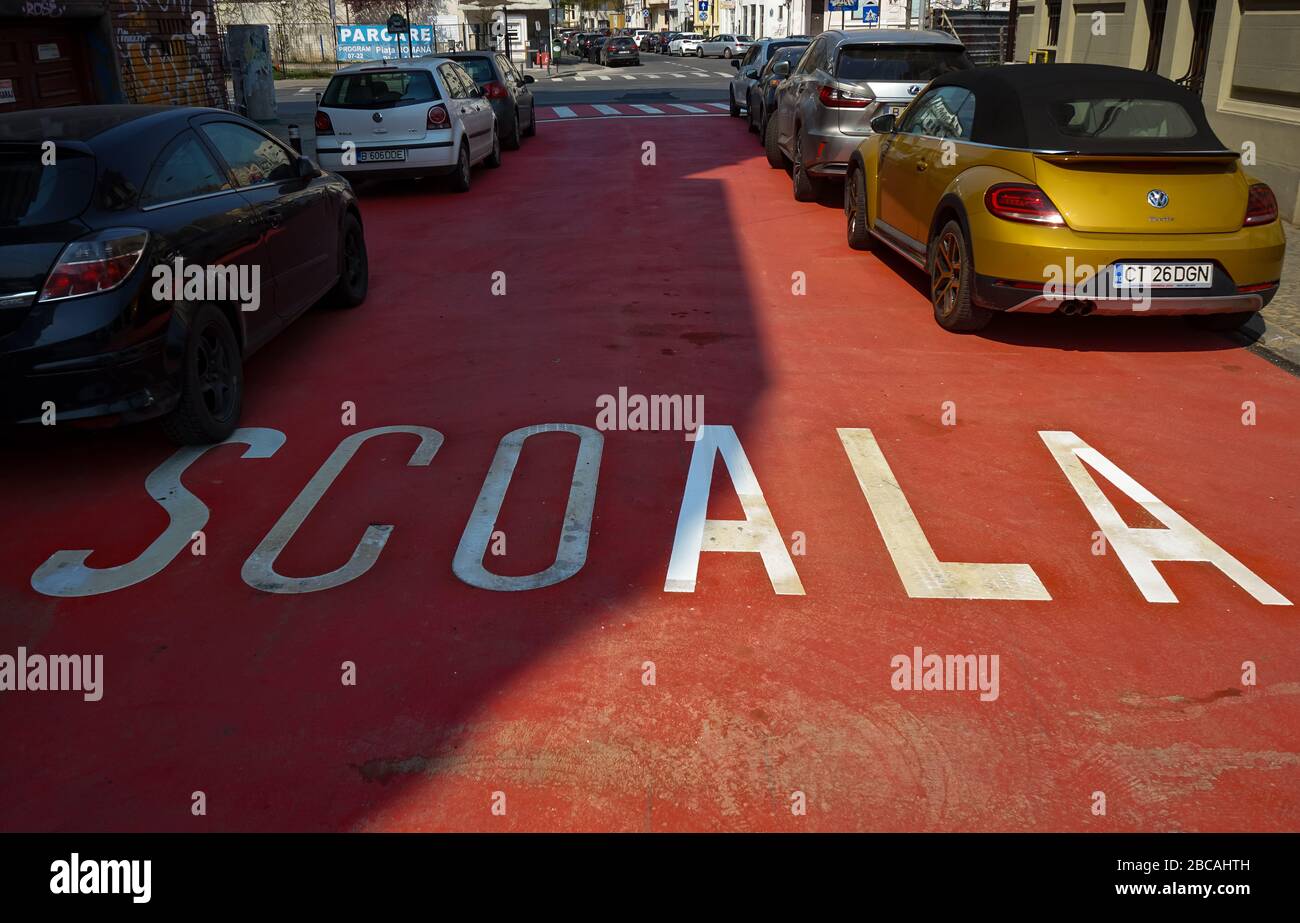 Bucharest, Romania - March 30, 2020: The word scoala, the romanian word ...