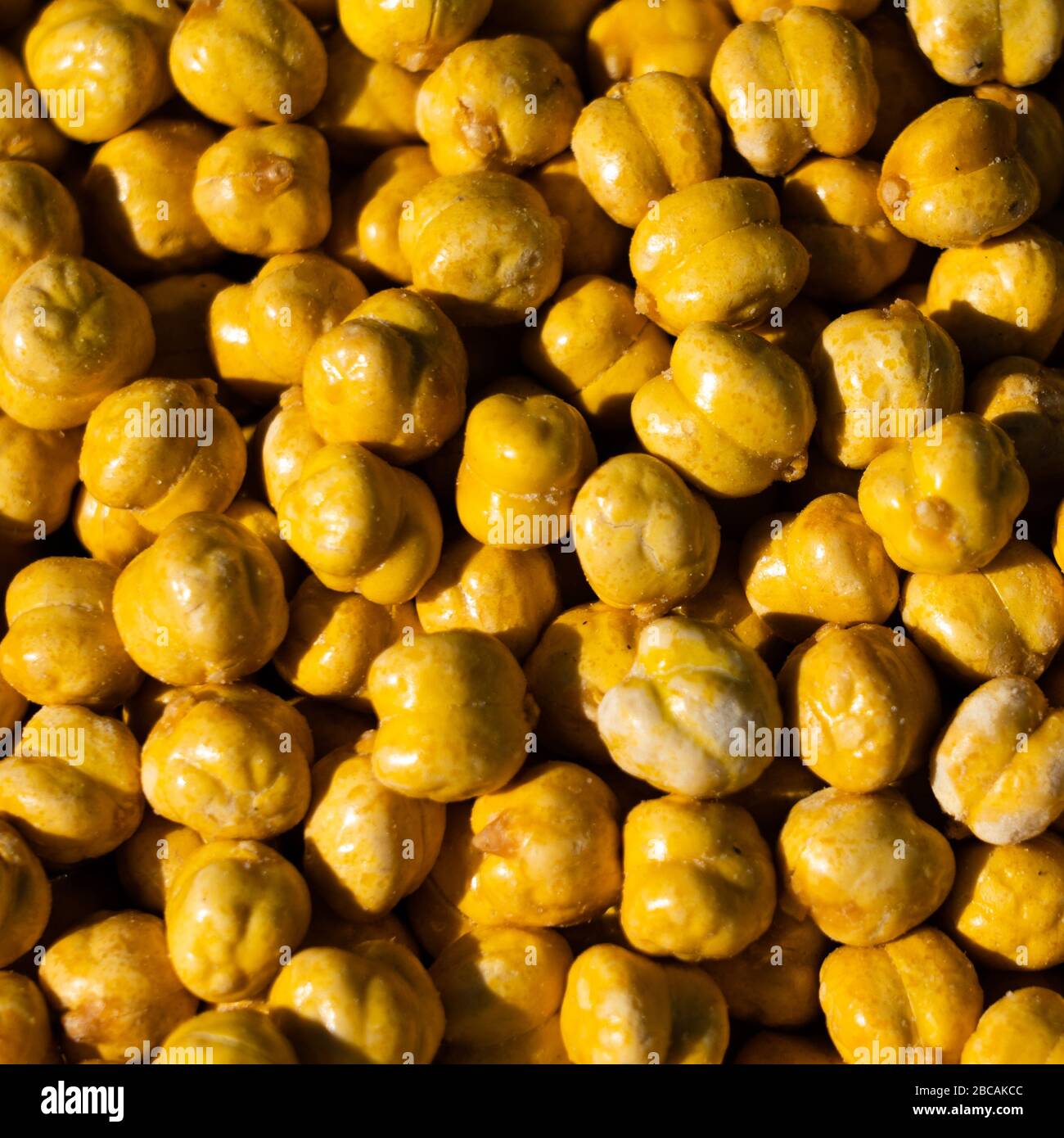 Roasted gram chana or chickpea nut. Bright sunlight gives sharp shadows ...