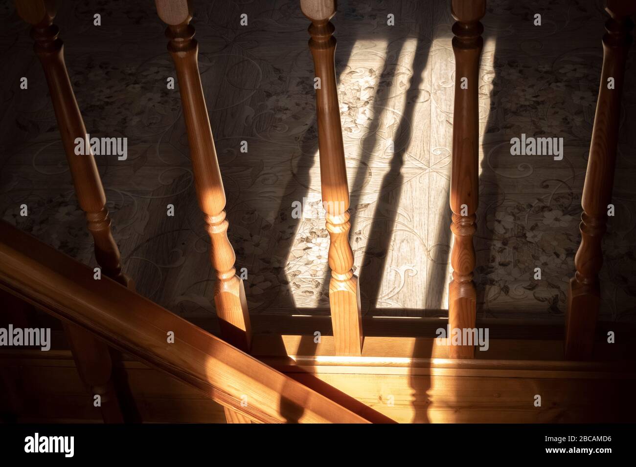 Element of a wooden interior staircase. Wooden baluster close-up Stock ...