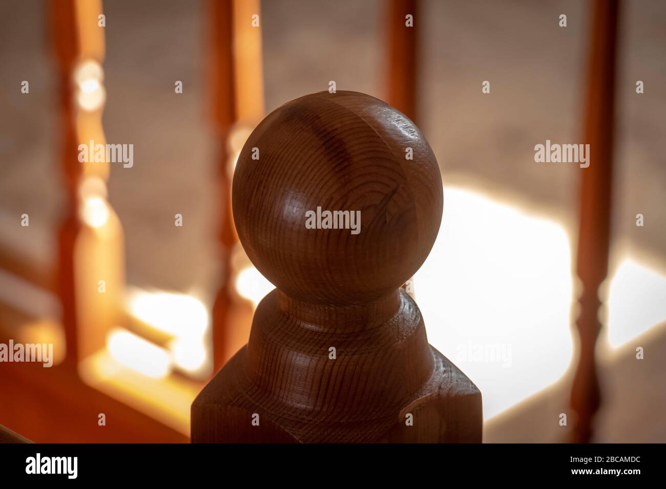Element of a wooden interior staircase. Wooden baluster close-up Stock ...