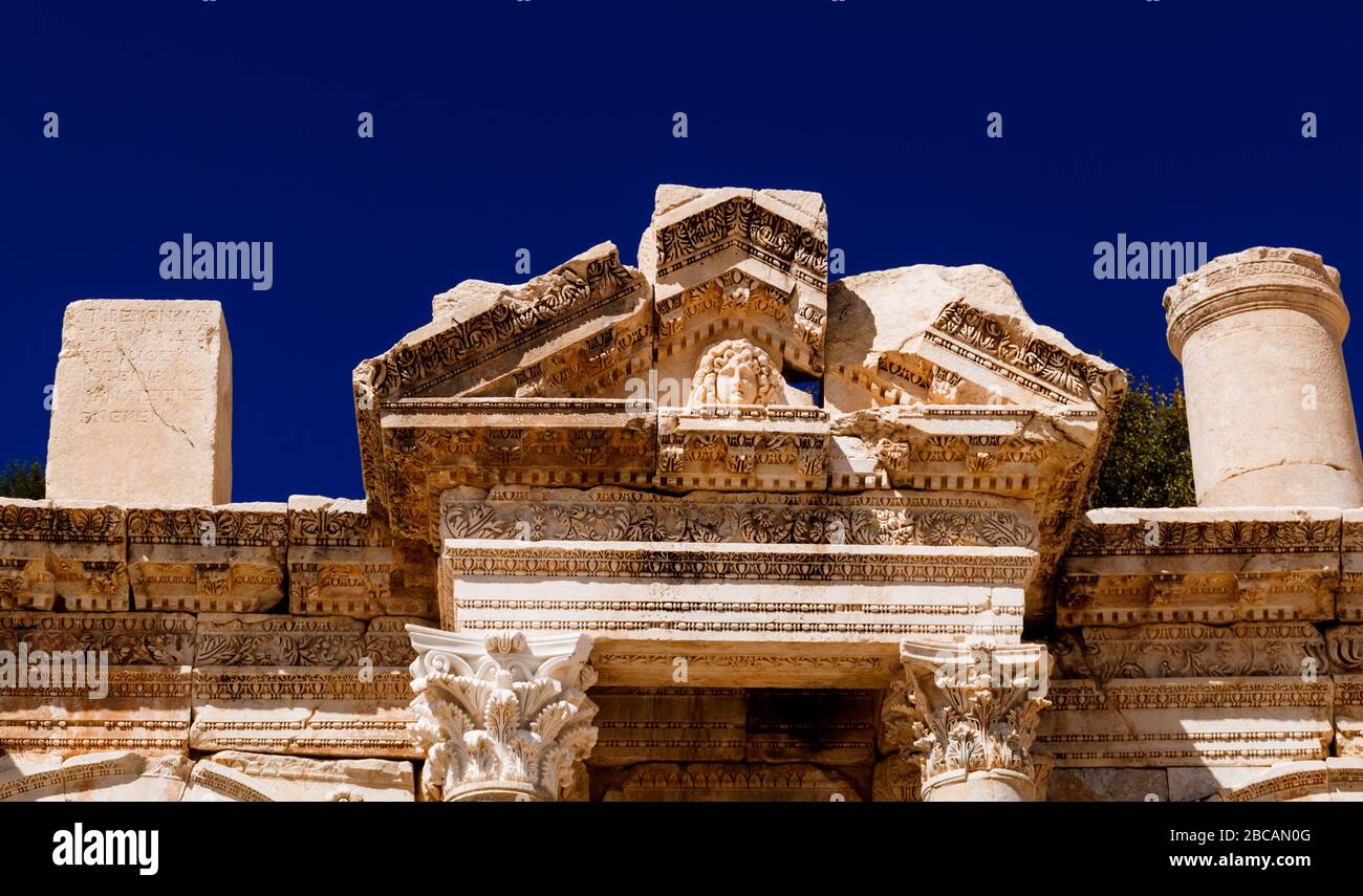 Decorative stone face on the facade fountain in ancient city Sagalassos ...