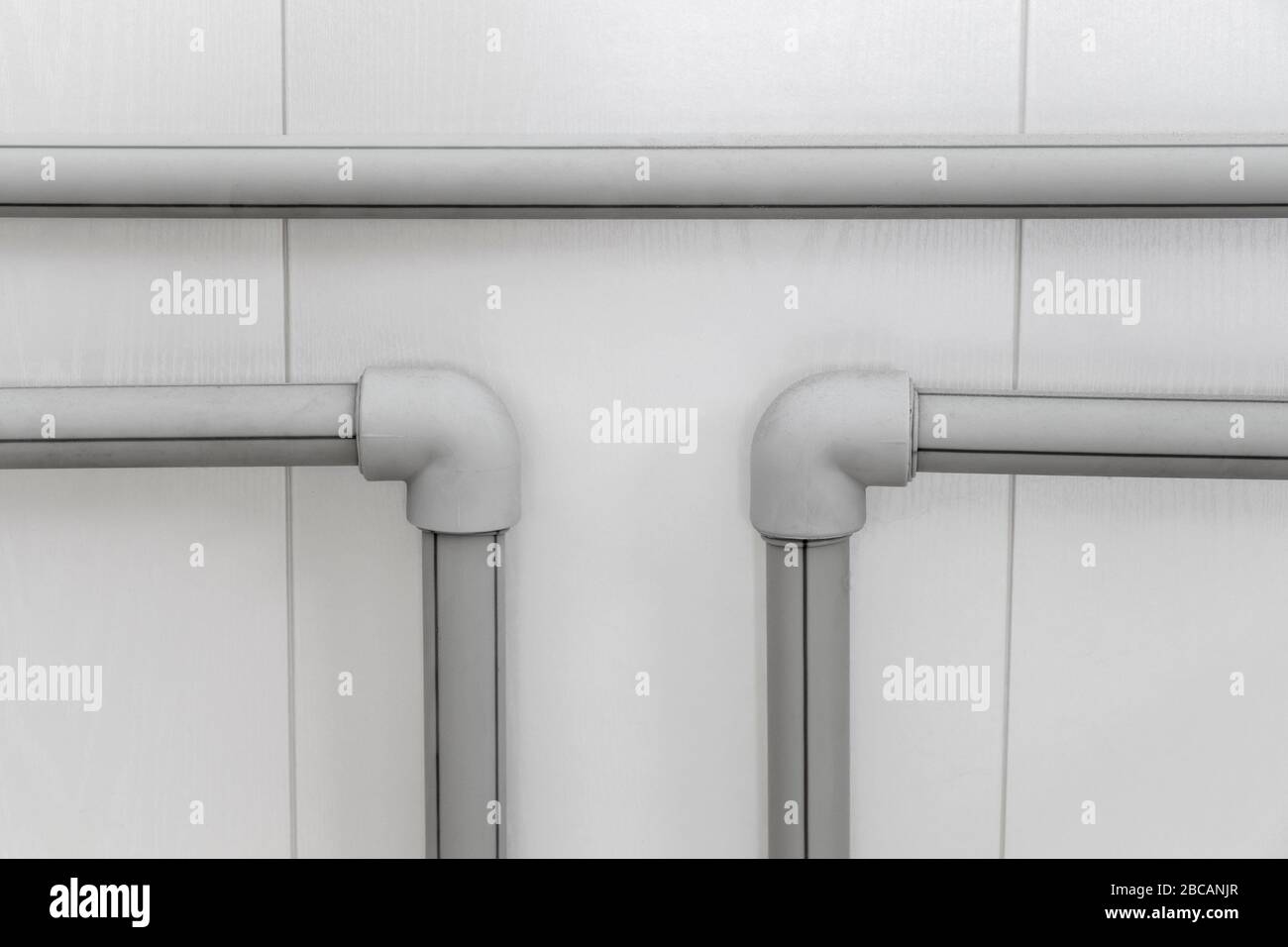 Gray plastic pipes of a home heating system Stock Photo - Alamy