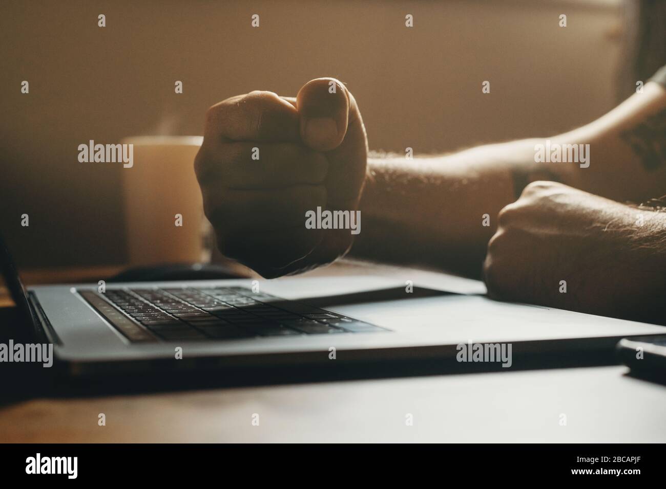 Man hitting table hand hi-res stock photography and images - Alamy
